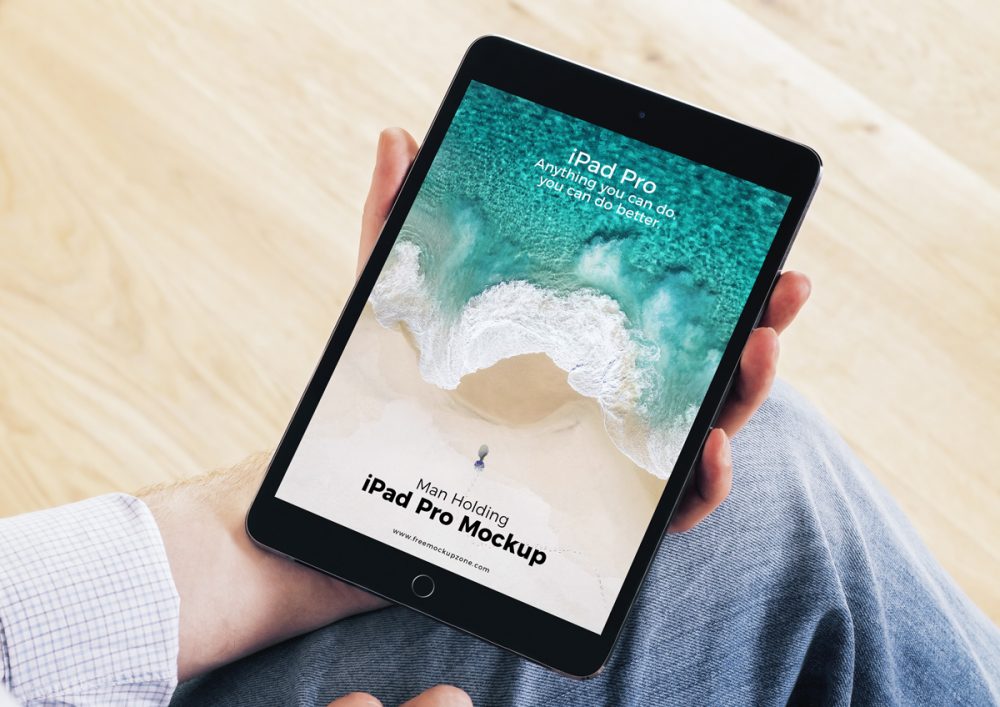 Free Man Holding iPad Pro Mockup